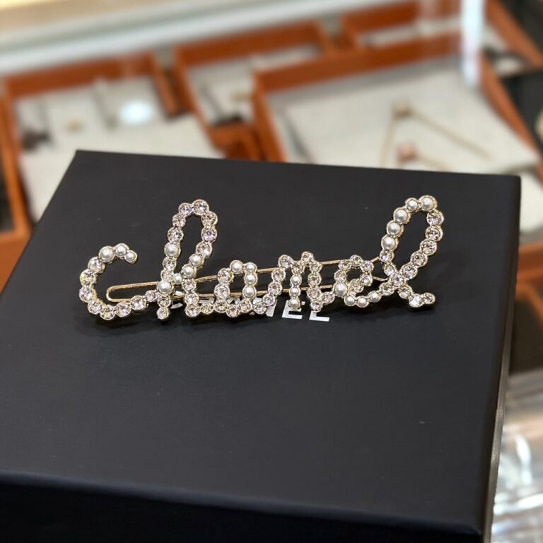 CHANEL Cursive Logo Hair Clip - Madame N Luxury